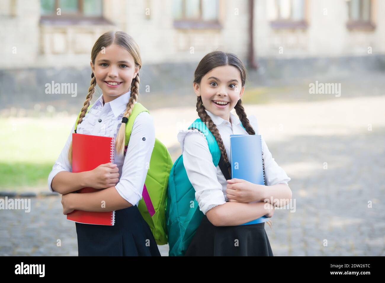 Time to learn. Happy kids hold study books outdoors. Study and ...