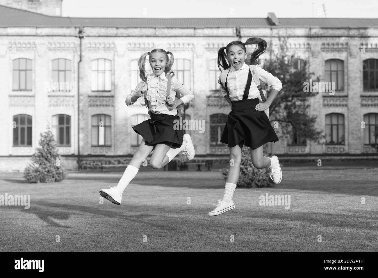 Excited happy girls school uniform running, september reunion concept ...