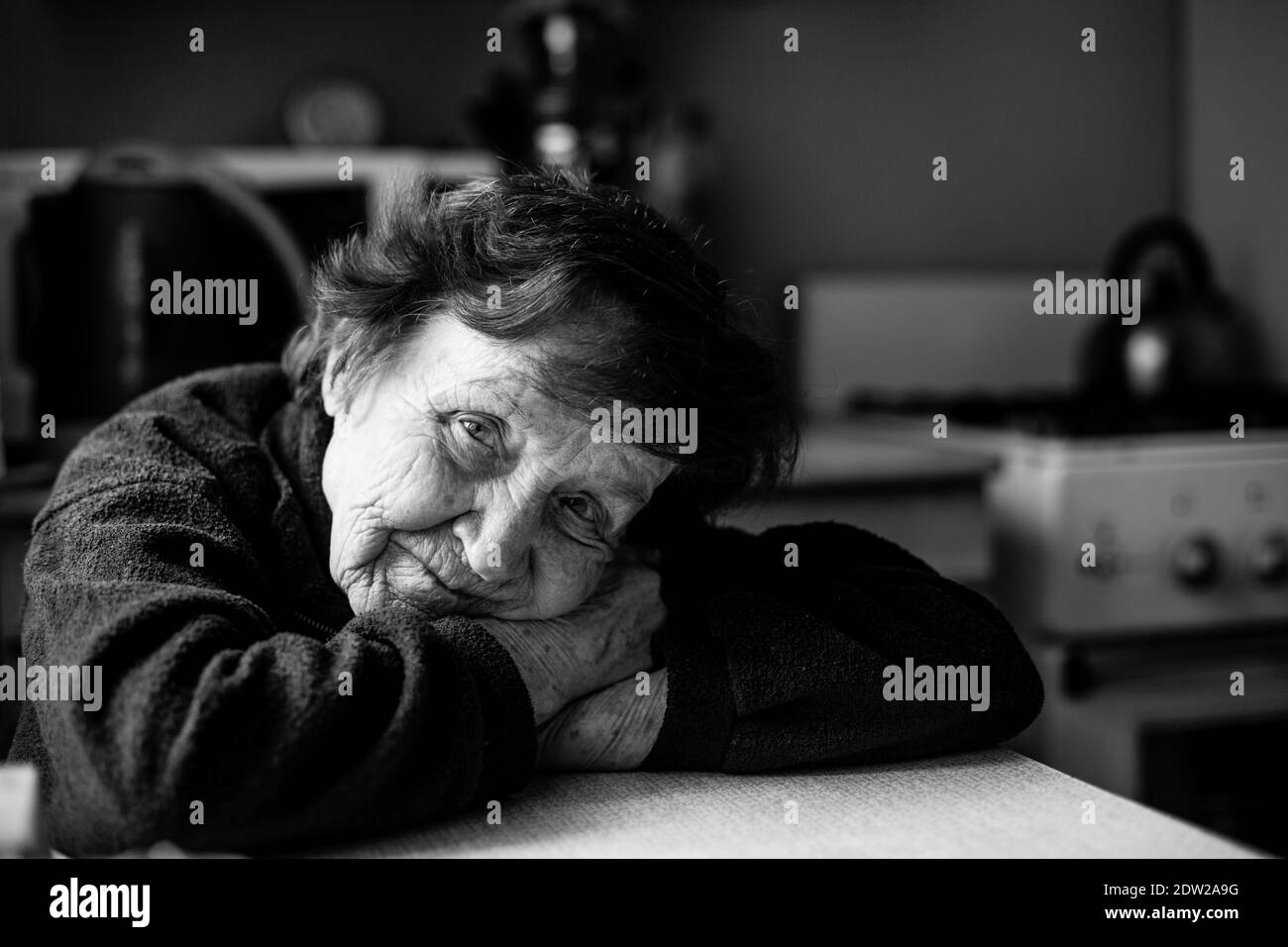 Portrait Of Old Woman In Her Home Black And White Photo Stock Photo portrait-of-old-woman-in-her-home-black-and-white-photo-stock-photo