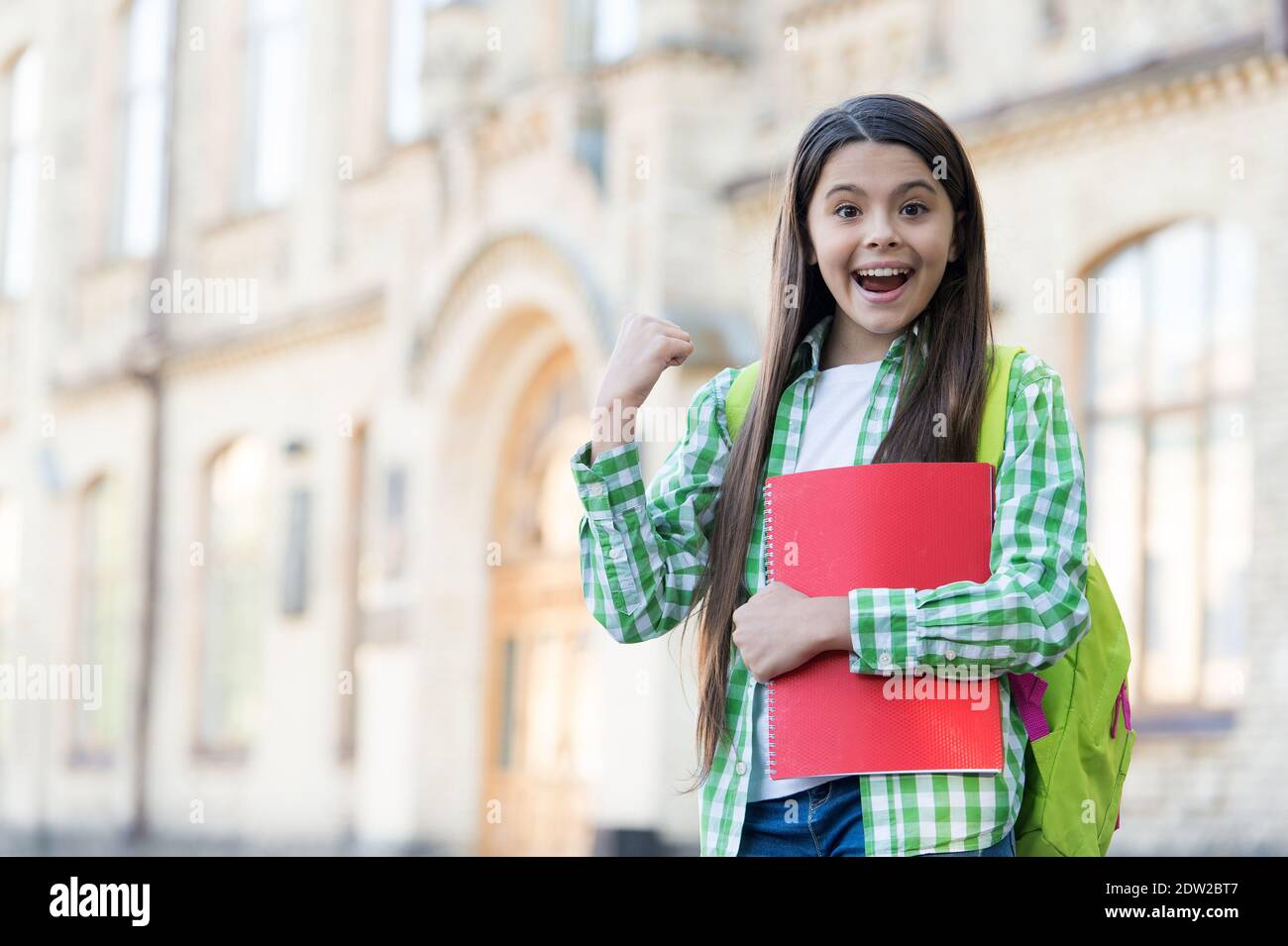 Educating for future. Happy child smile with books outdoors. School ...