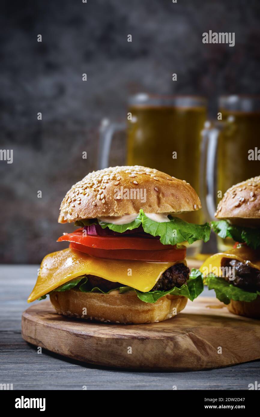Homemade hamburger close-up with beer on table Stock Photo - Alamy