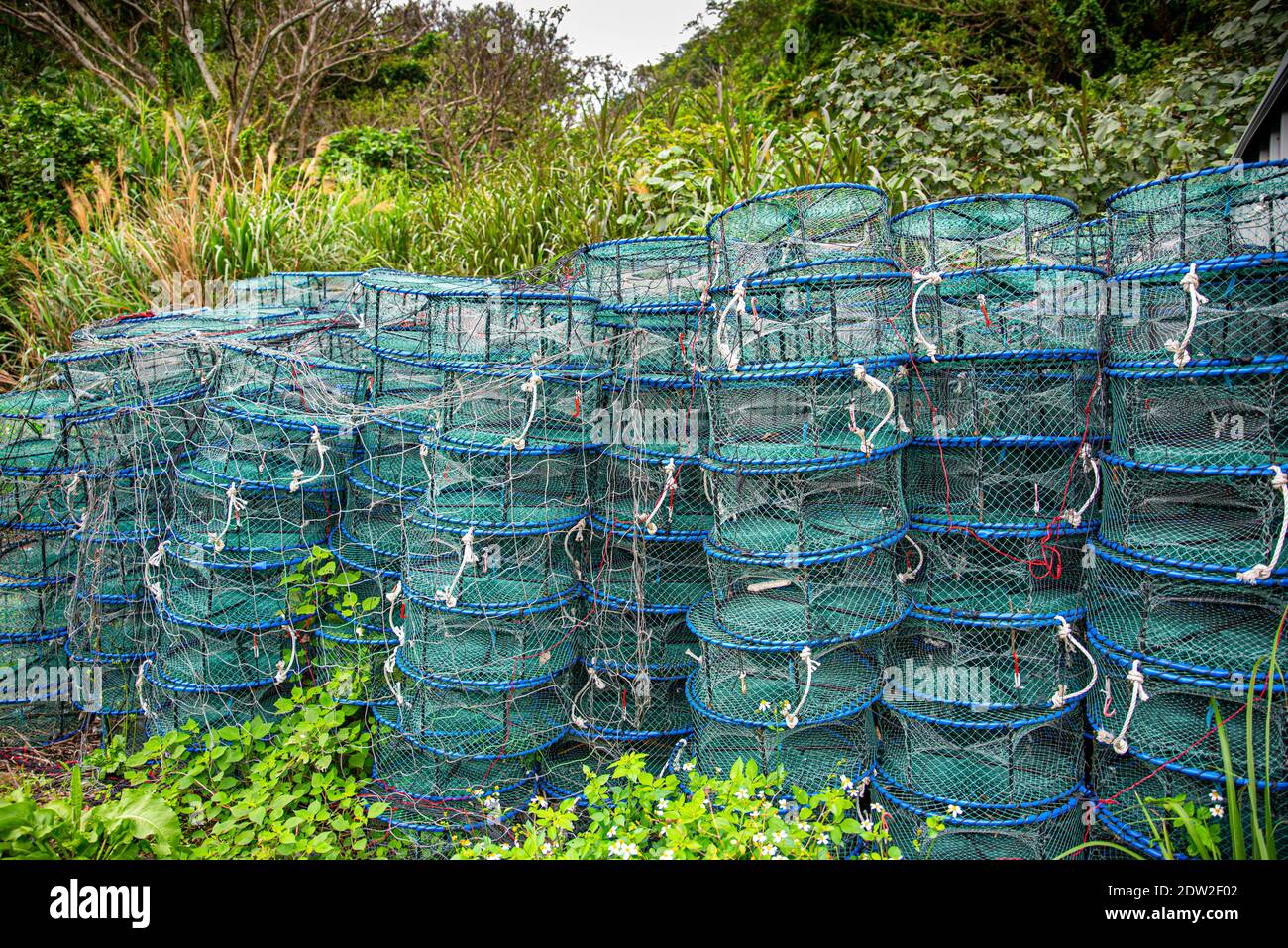Lots of stacked nets for seafood Stock Photo - Alamy