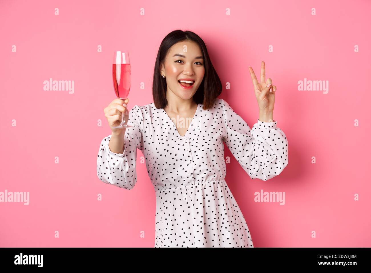 Cute asian female model drinking champagne, celebrating on party and ...