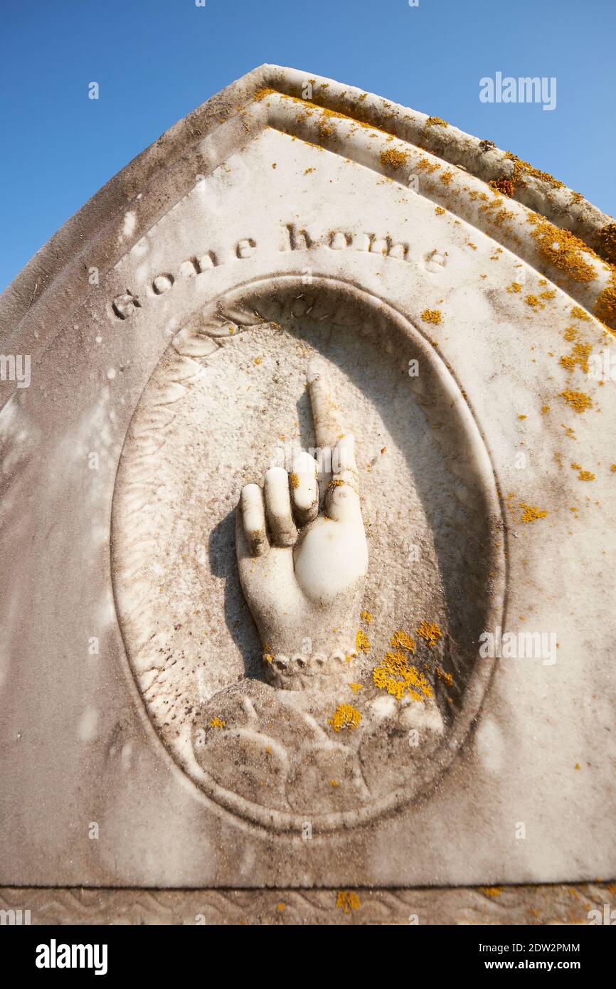 An old marble grave with a hand pointing up carving and the words Going ...