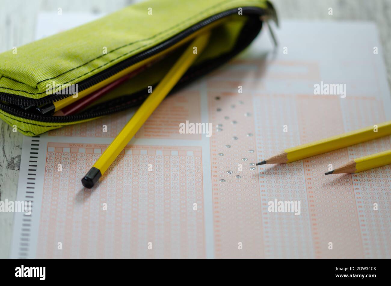 Close up of multiple choice examination form or optical mark paper and ...