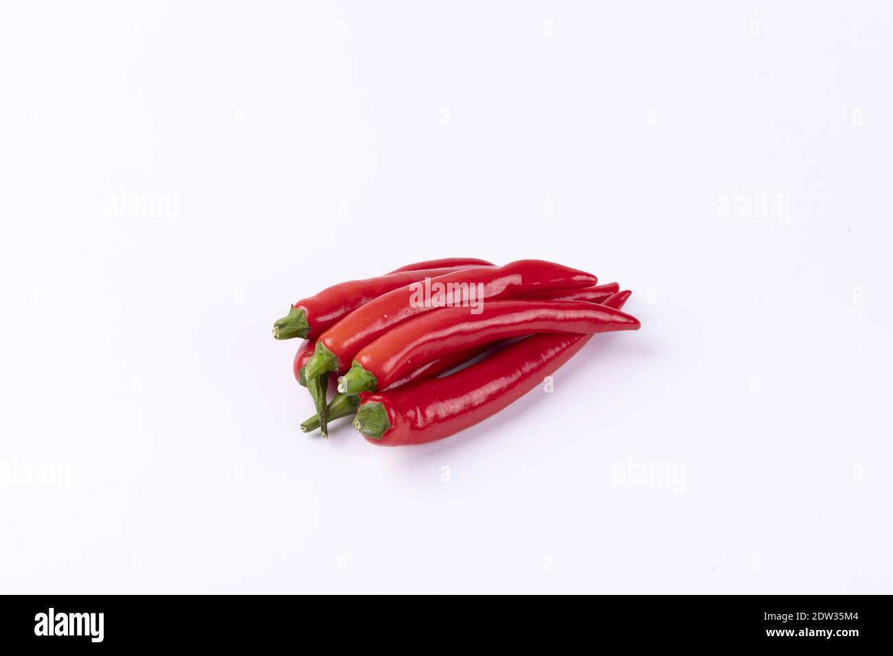 Fresh chili peppers isolated on a white background Stock Photo - Alamy