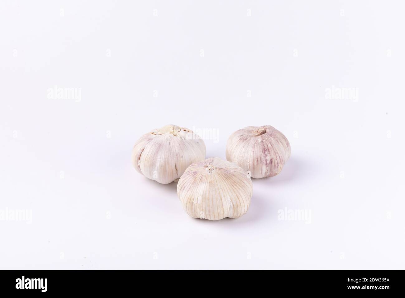 Fresh garlics isolated on a white background Stock Photo - Alamy