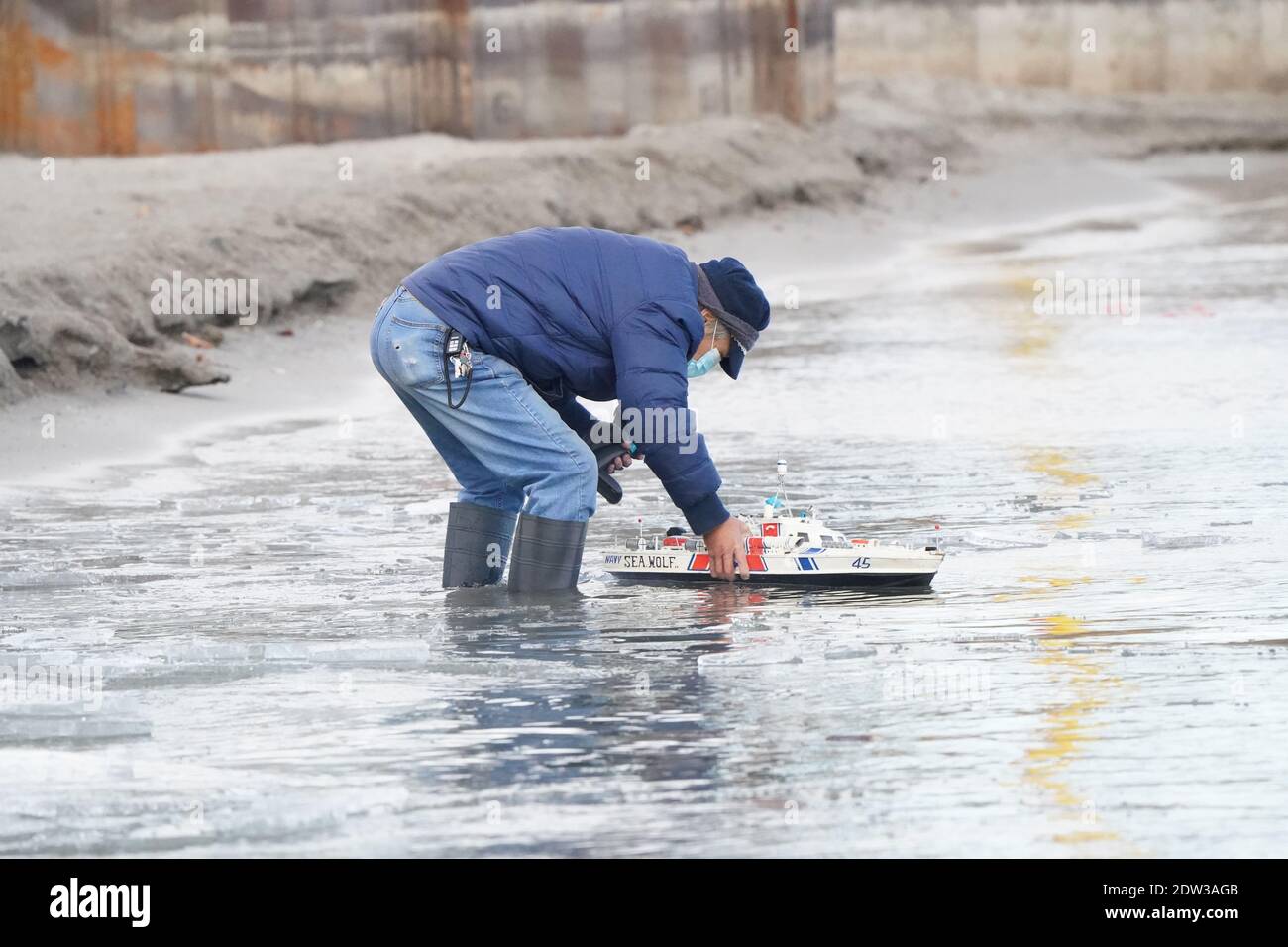 Man model putting on jacket hi-res stock photography and images - Alamy