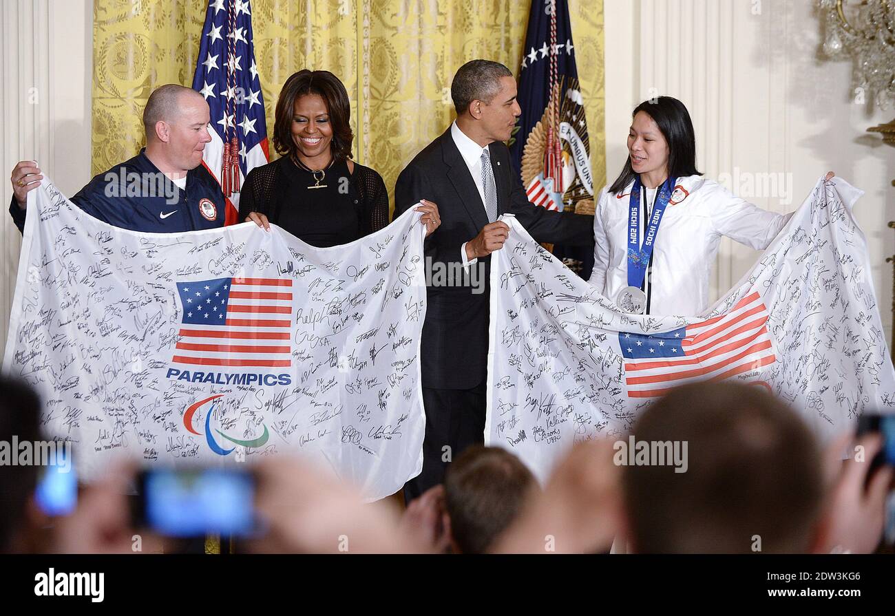 U.S. President Barack Obama and first lady Michelle Obama accept ...