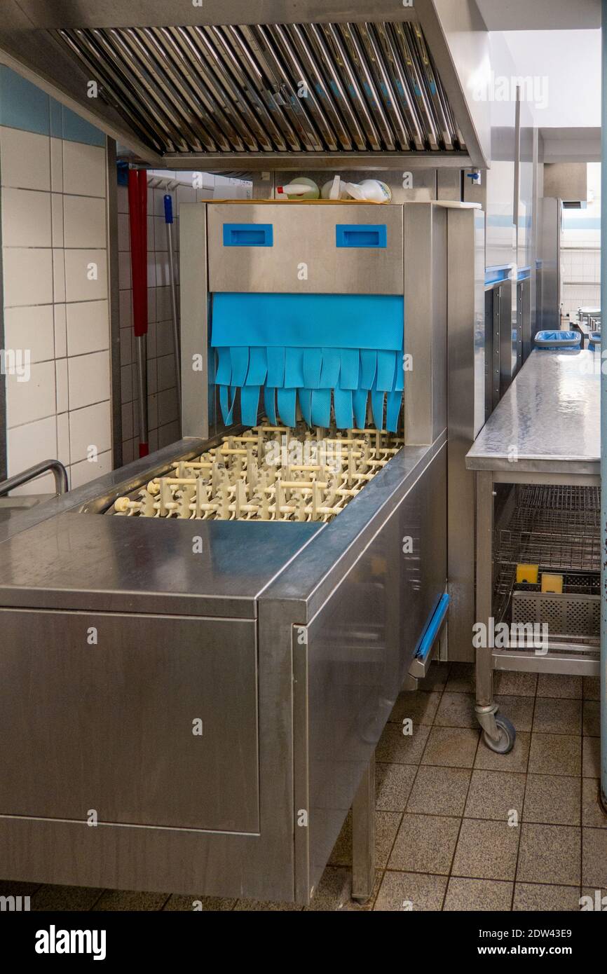 in a hospital kitchen there is a dish washing line Stock Photo - Alamy