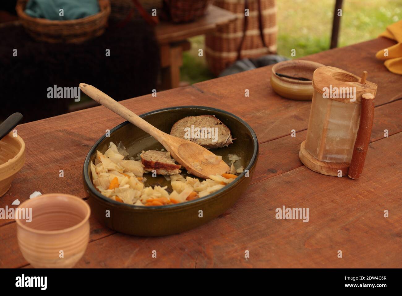 Half eaten medieval stew presented in authentic dish Stock Photo - Alamy