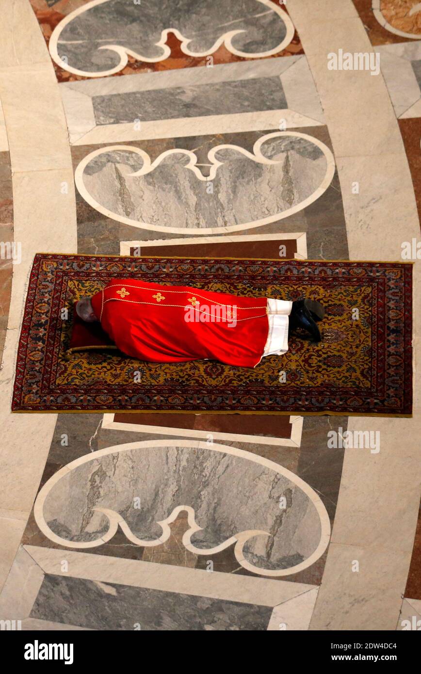 Pope Francis lies down in prayer during the Passion of Christ Mass on ...