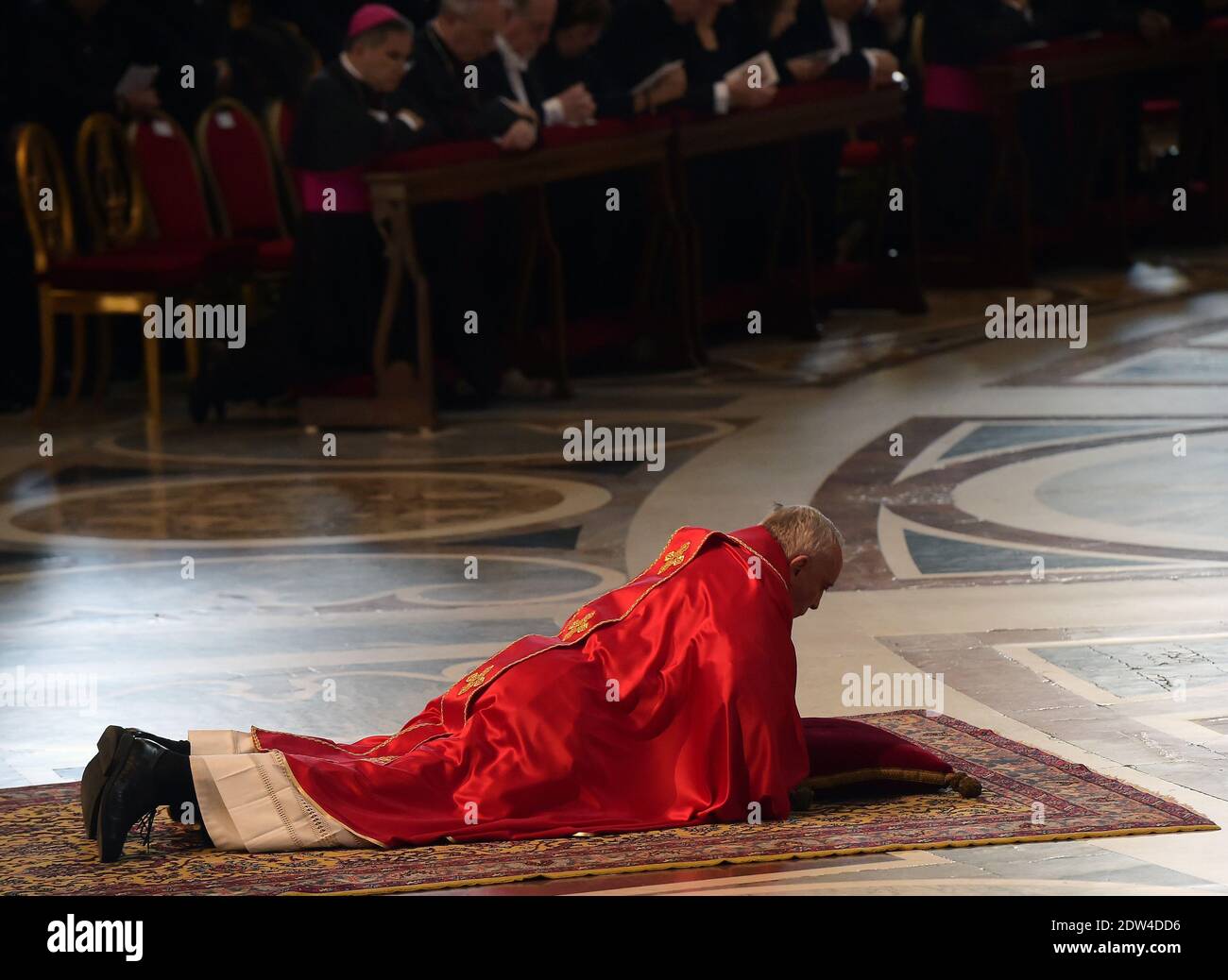 Pope Francis lies down in prayer during the Passion of Christ Mass on ...
