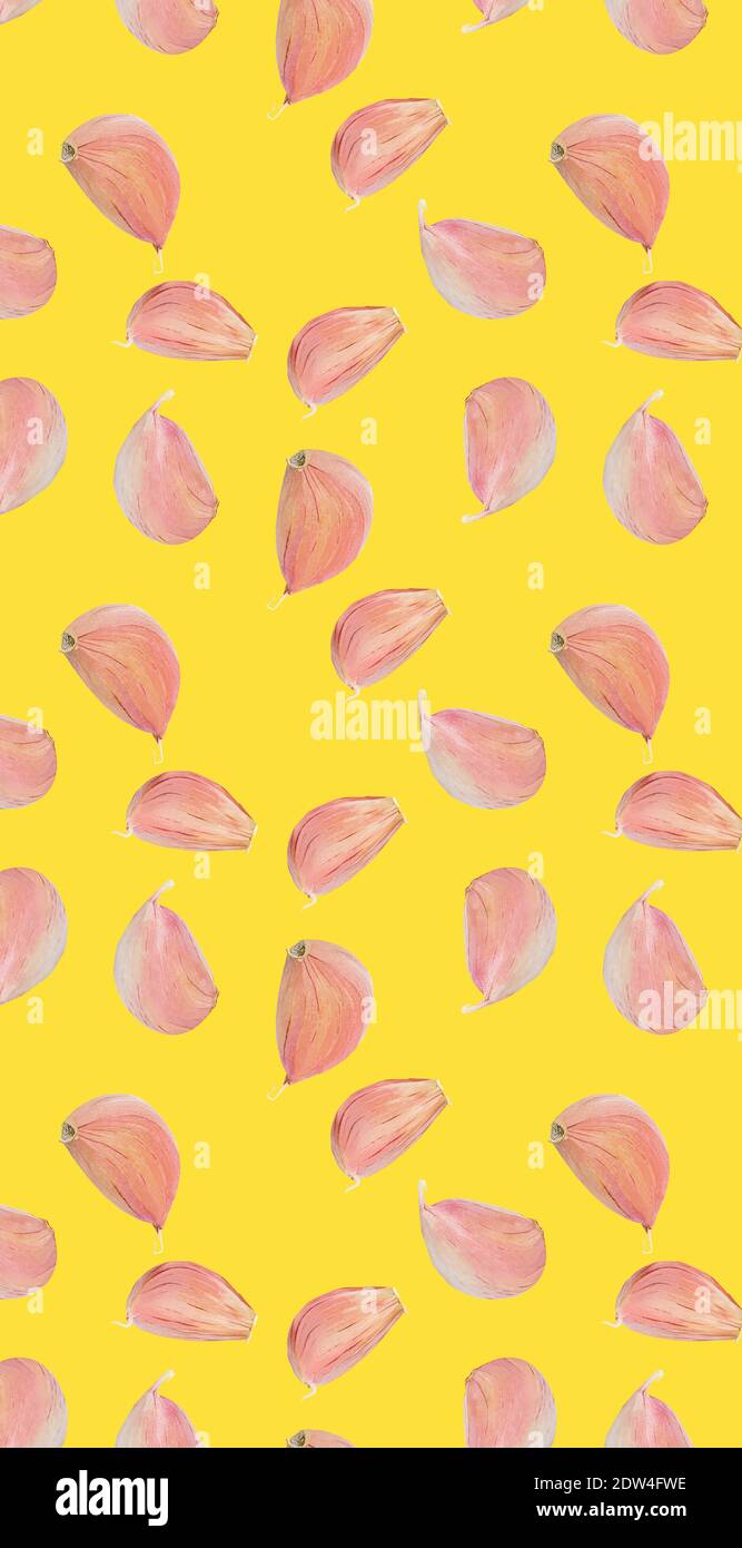 Pattern of fresh raw garlic clove isolated on yellow texture Stock ...