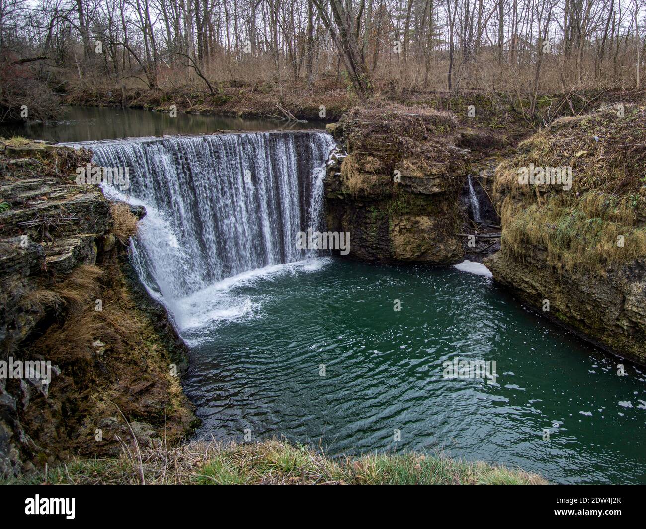 Winter waterfall landscape and river flowing through the gorge Stock ...