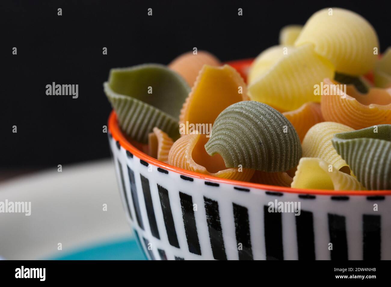 A bowl with Italian pasta in the shape of snails known as conchiglie in ...