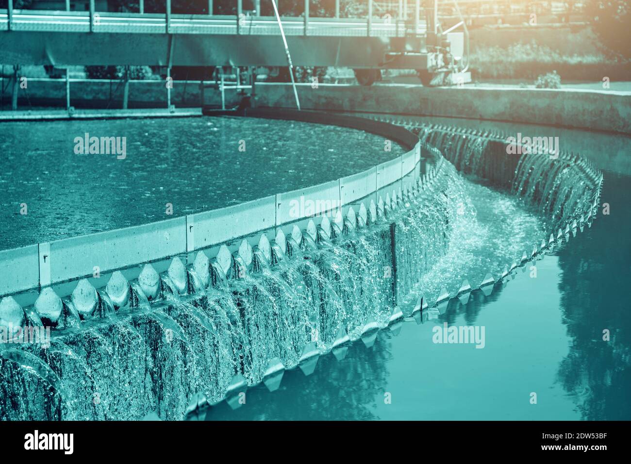 Recirculation sedimentation tank at wastewater treatment plant, toned ...