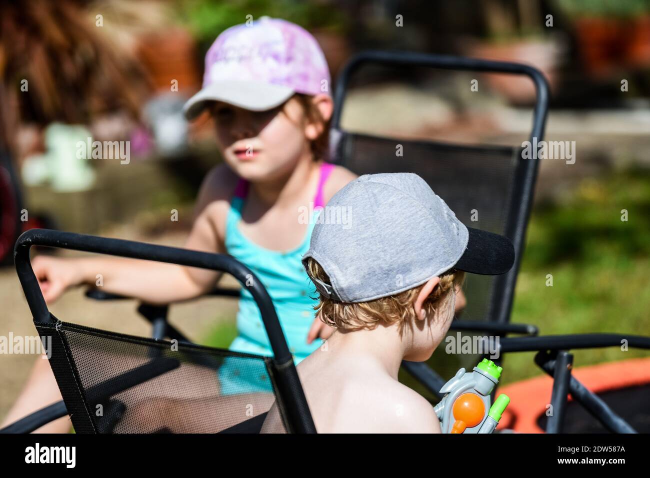 Girl sitting in lawn chair hi-res stock photography and images - Alamy