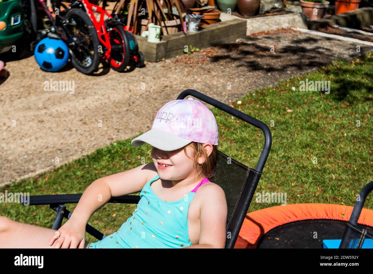 Boy girl sitting on chair hi-res stock photography and images - Alamy