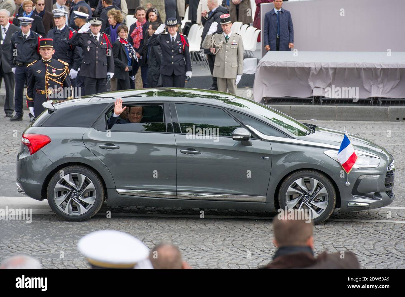 French President Francois Hollande leaves the ceremony in his Citroen ...