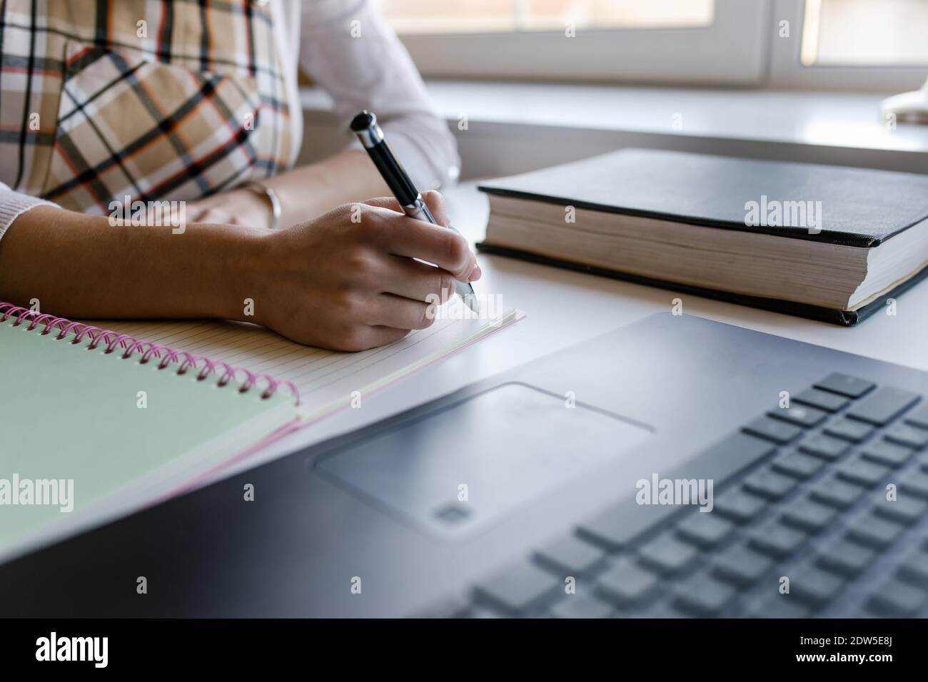 Student writing paper desk hi-res stock photography and images - Alamy