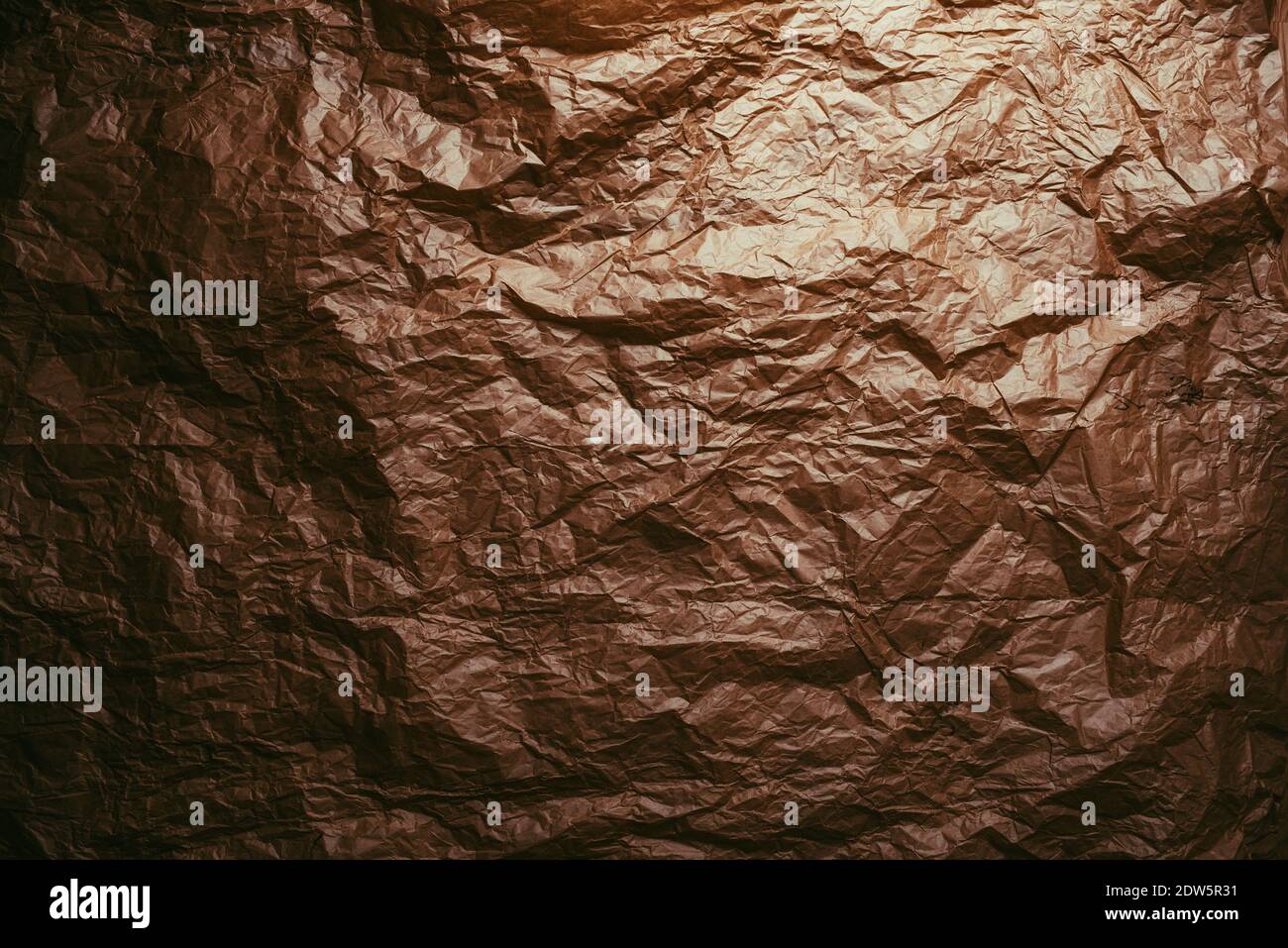 Crumpled and expanded paper with natural texture of reddish tones Stock ...