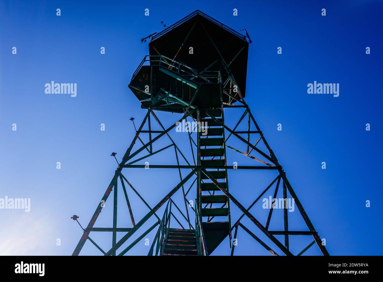 High forest watchtower on top of a peak Stock Photo - Alamy