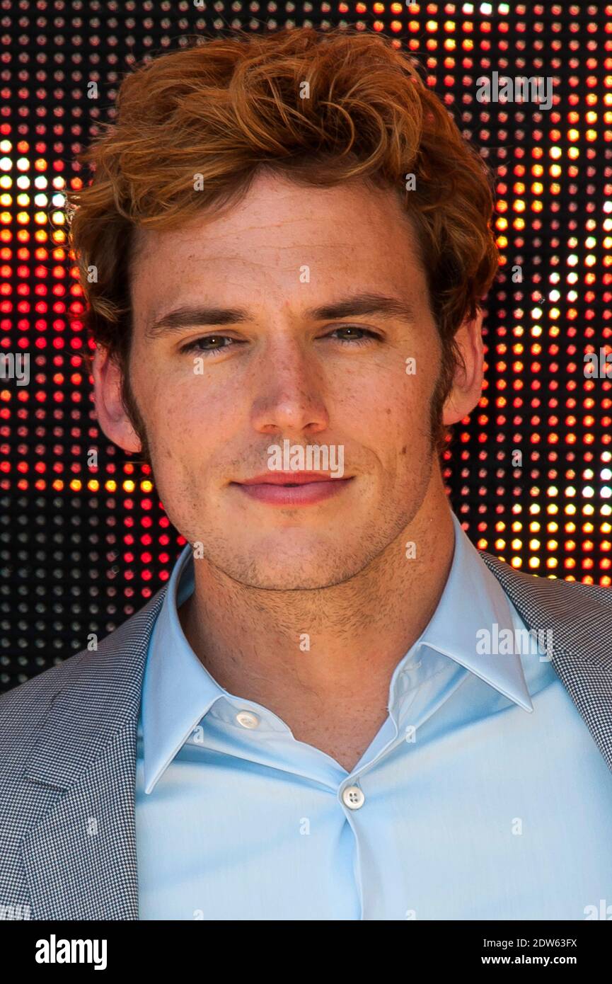 Sam Claflin at a photocall for the film 'The Hunger Games : Mockingjay ...