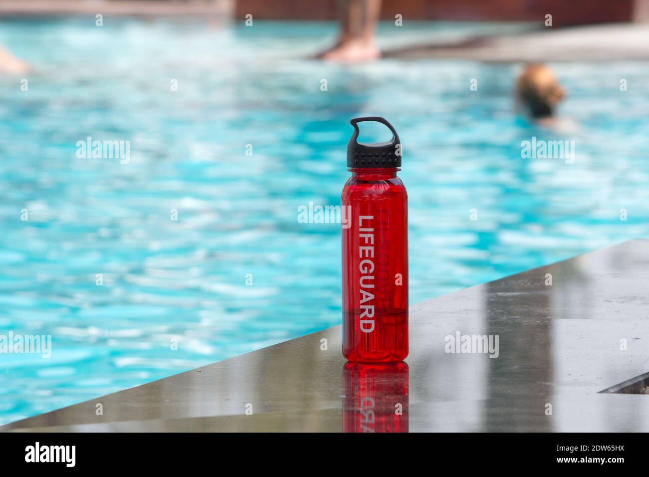 lifeguard equipment next to bright blue pool Stock Photo - Alamy