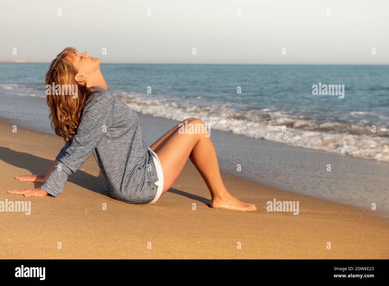 Woman thinking about the beach Stock Photo - Alamy
