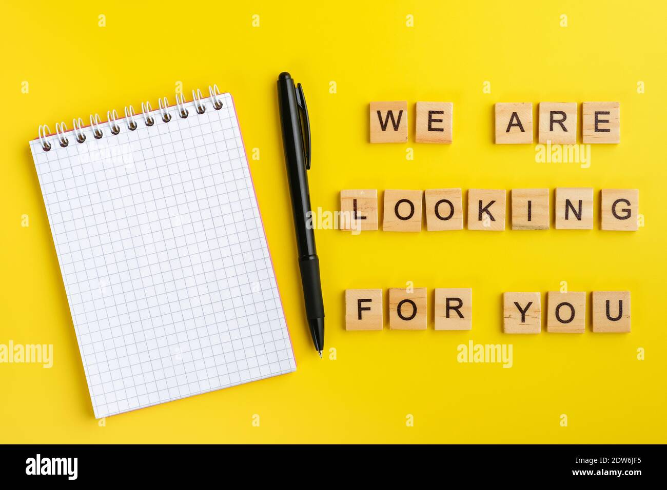 wooden block lettering we are looking for you and magnifying glass ...