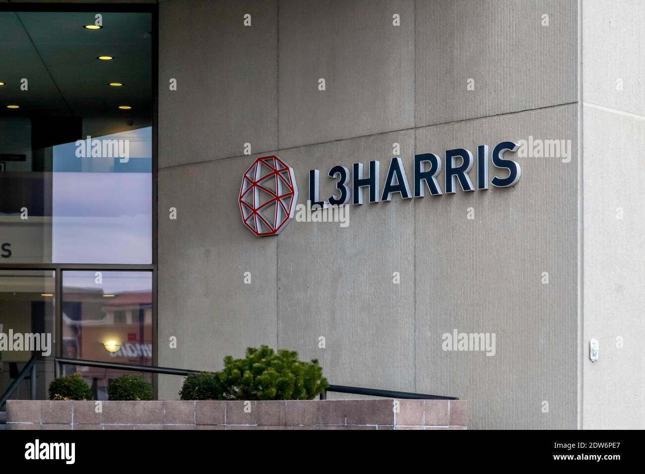 L3Harris sign at the entrance of its office building in Rochester, New ...