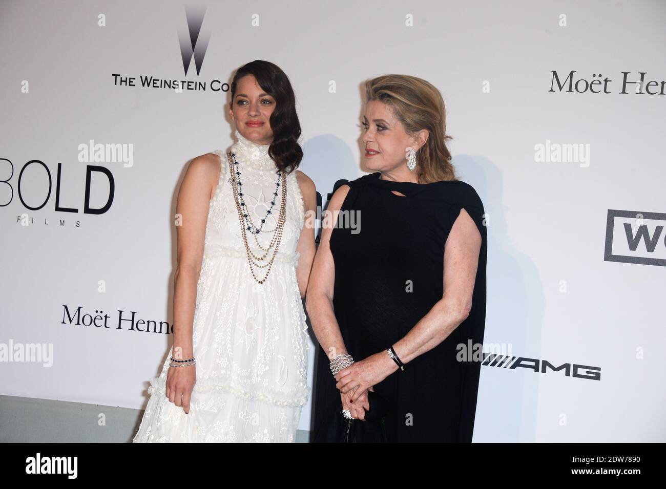 Marion Cotillard, Catherine Deneuve arriving at amfAR's 21st Cinema ...