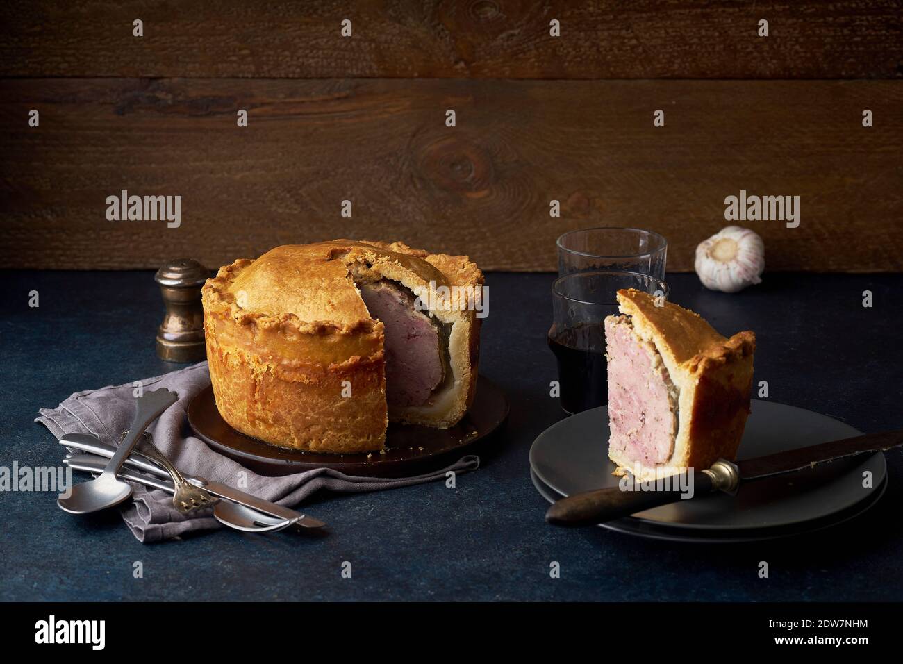 Traditional british raised pork pie with bacon and herbs Stock Photo ...