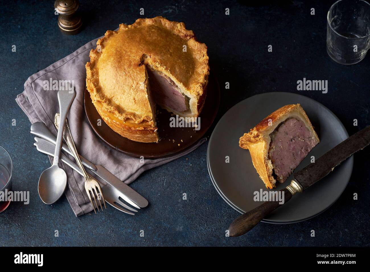 Traditional british raised pork pie with bacon and herbs Stock Photo ...