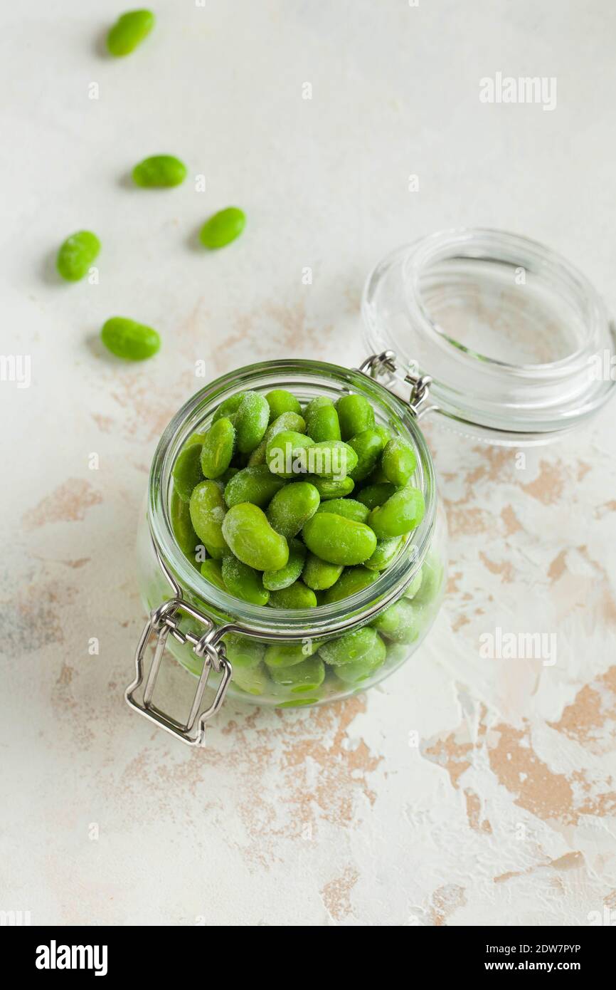 Frozen Soy beans in a glass jar. Freezing is a safe method of ...