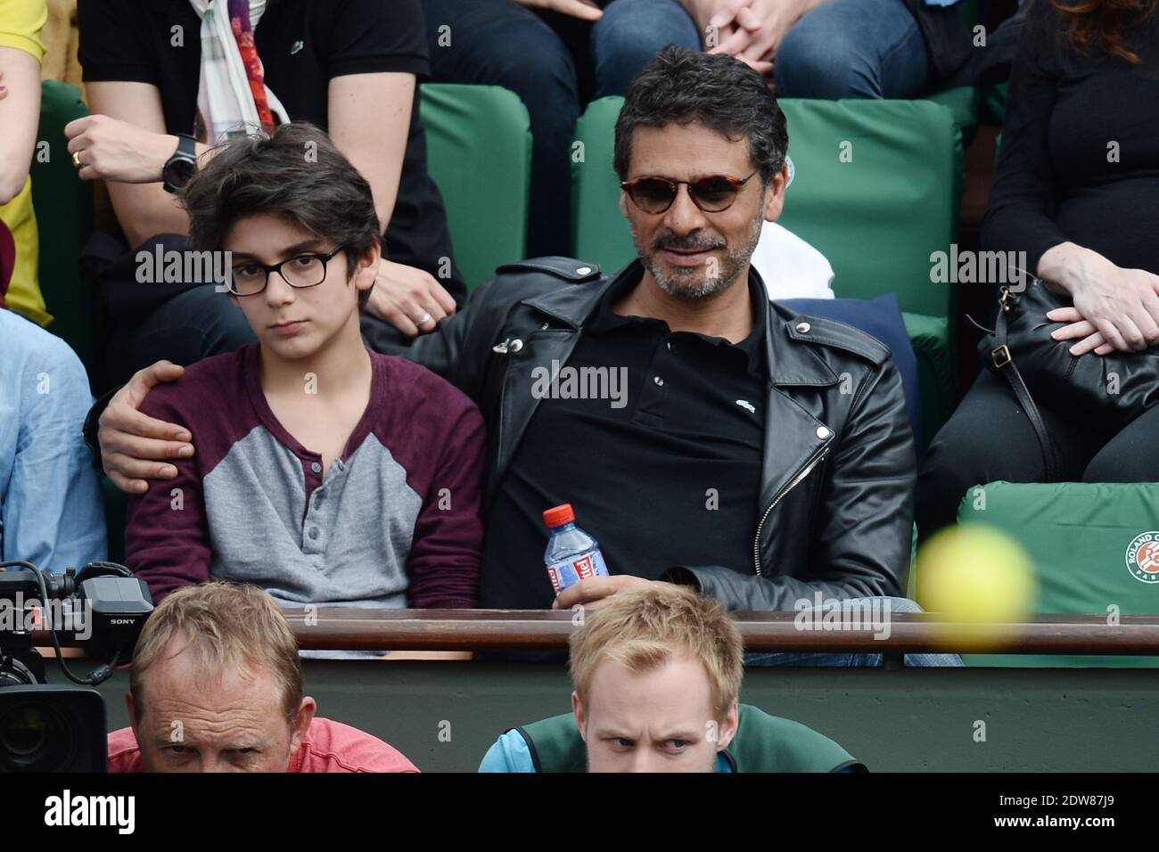 Pascal Elbe and his son watching a game during the eight-final round of ...