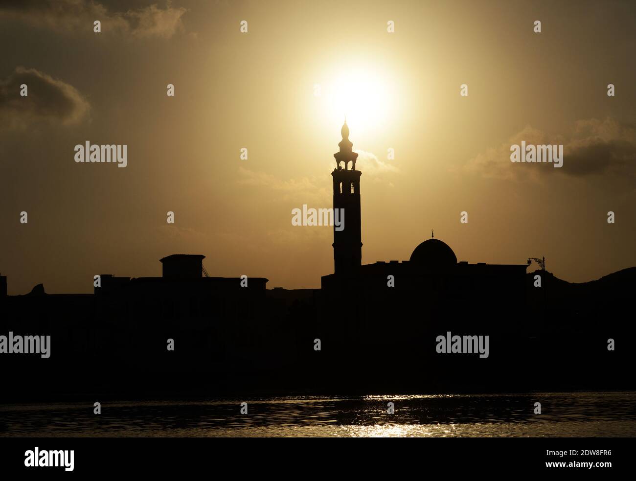 Sunset over a mosque in Sur, Oman Stock Photo - Alamy