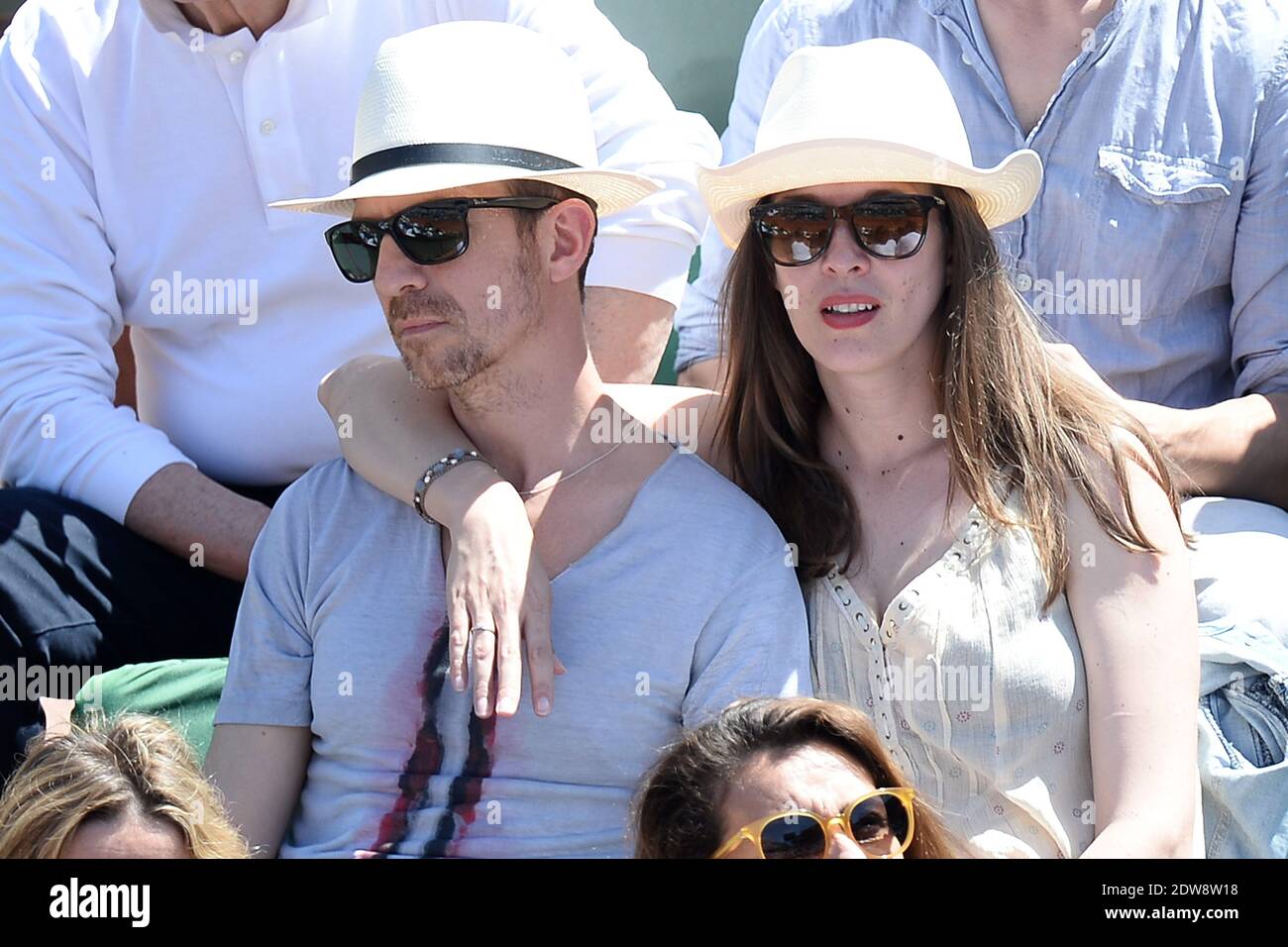 Calogero and his wife attending a French tennis Open semi-final match ...