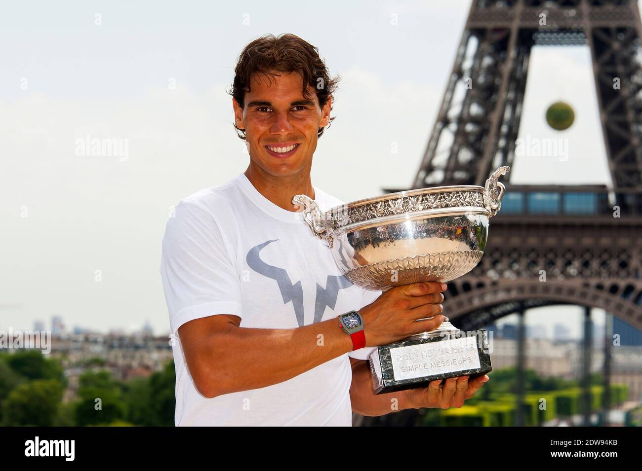 Rafael Nadal holds the championship trophy during a posing session in ...