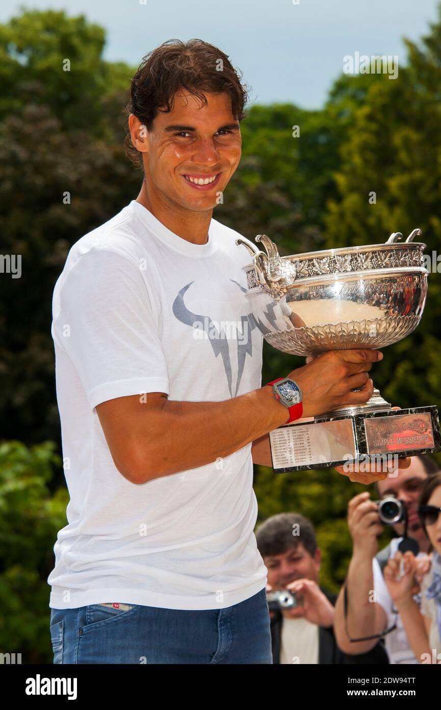 Rafael Nadal holds the championship trophy during a posing session in ...