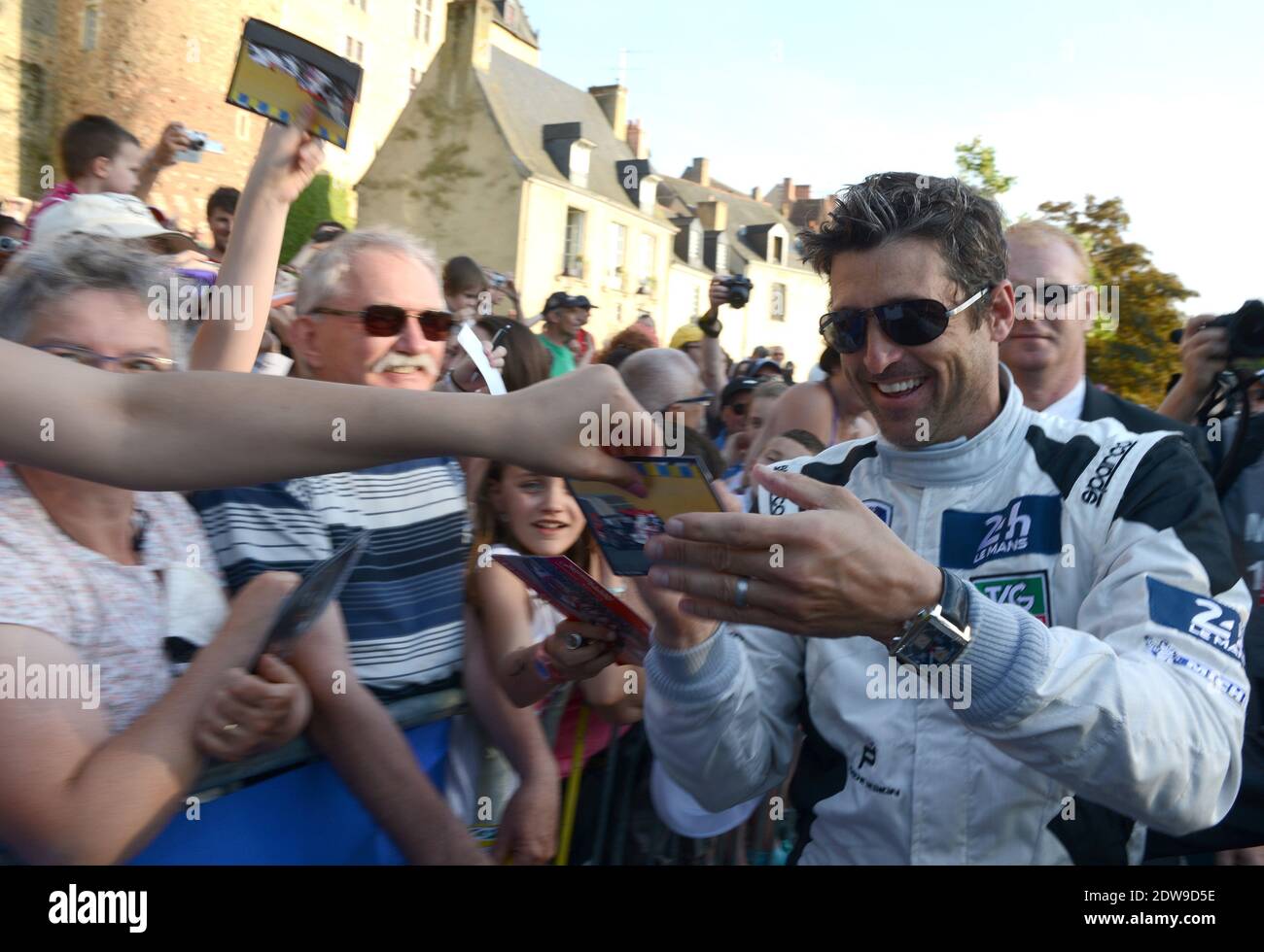 Patrick Dempsey signs and poses with his fanson the parade of 24 Heures ...