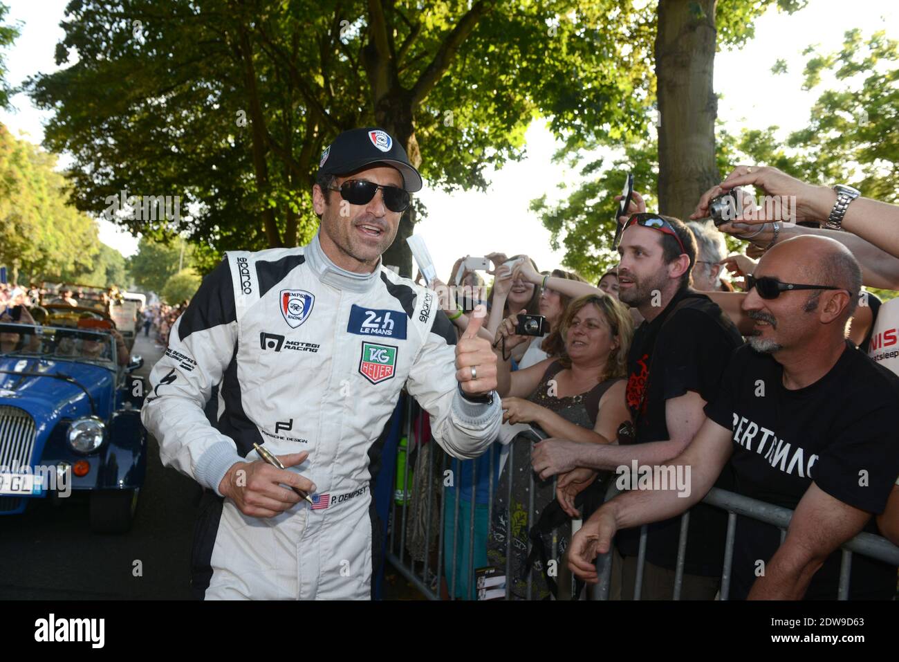 Patrick Dempsey signs and poses with his fanson the parade of 24 Heures ...