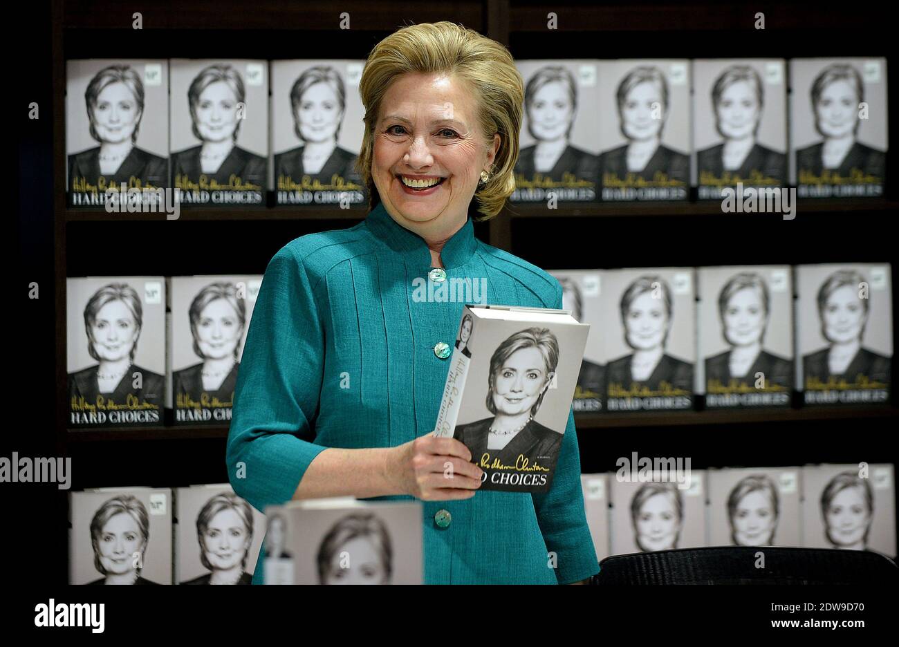 Former Secretary of State Hillary Clinton poses with her new book ...