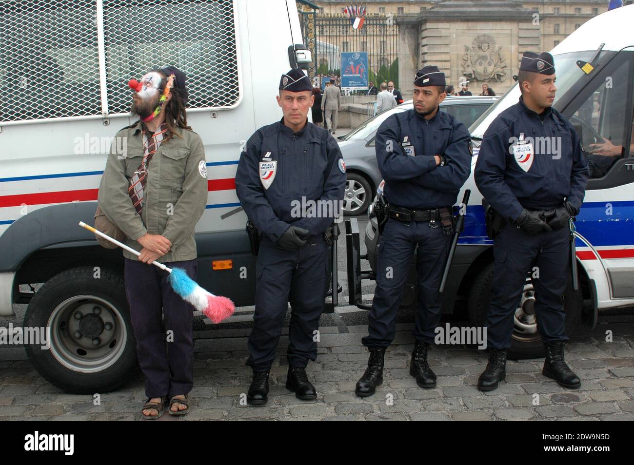 Peace activists dressed as soldiers clowns demonstrate by faking death ...