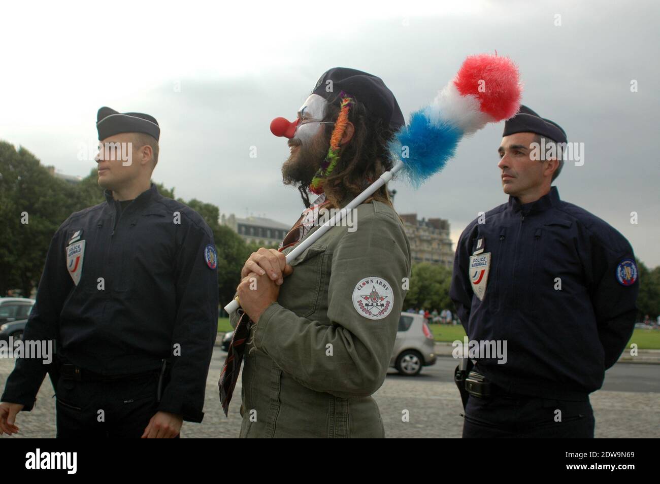Peace activists dressed as soldiers clowns demonstrate by faking death ...