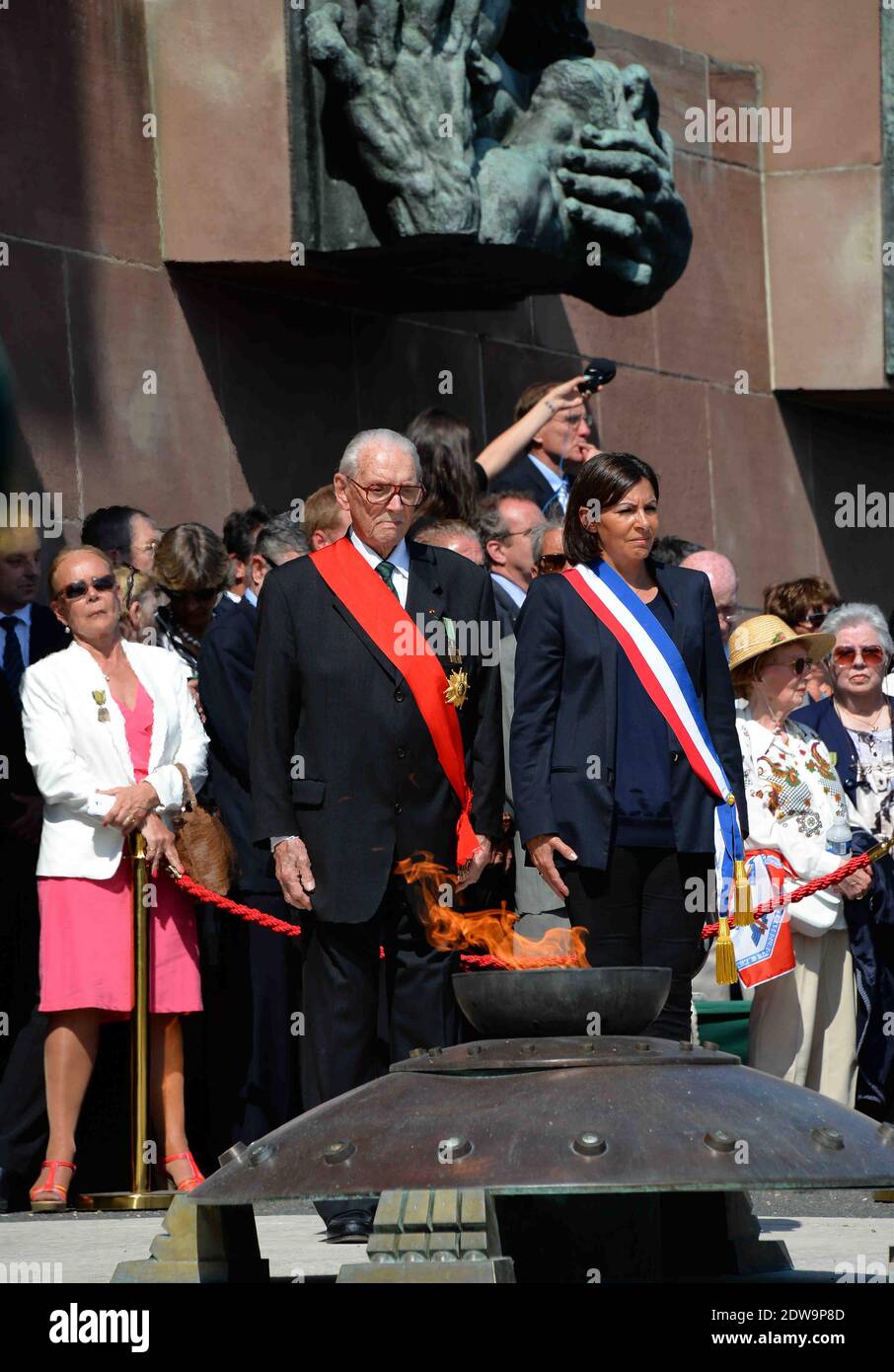 President Francois Hollande, along with paris Mayor Anne Hidalgo ...