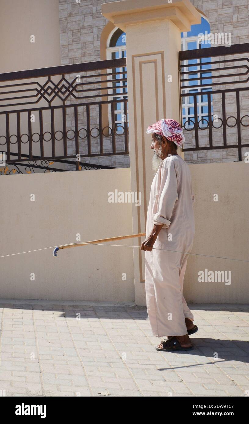 An Omani man walking in Sur, Oman Stock Photo - Alamy