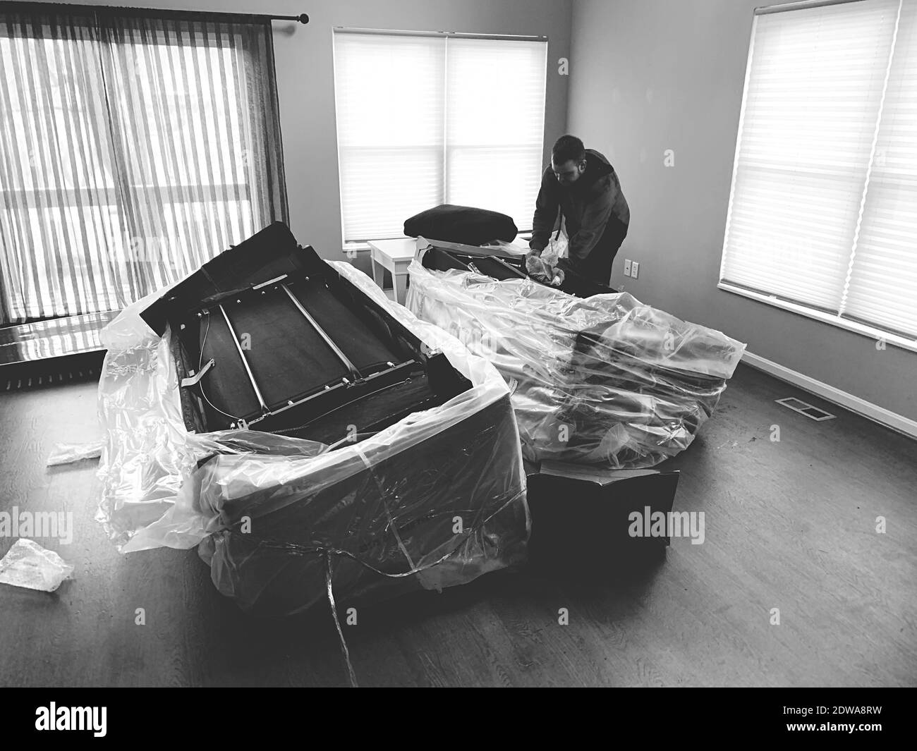 Man Unpacking Sofa At Home Stock Photo Alamy man-unpacking-sofa-at-home-stock-photo-alamy