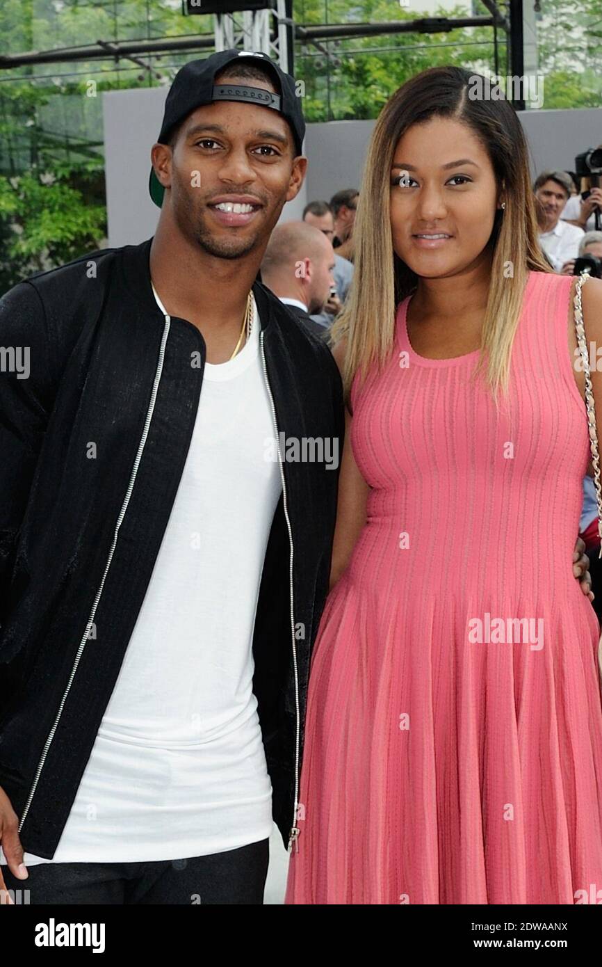 Victor Cruz and Elaina Watley attending Louis Vuitton's Spring-Summer ...